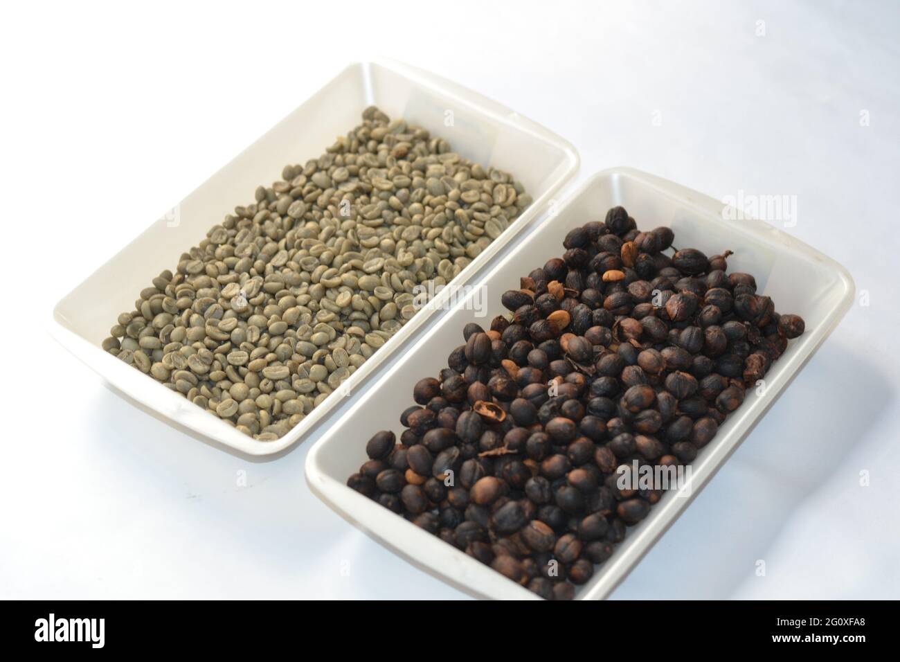Coffee beans in plastic containers isolated on a white background Stock ...