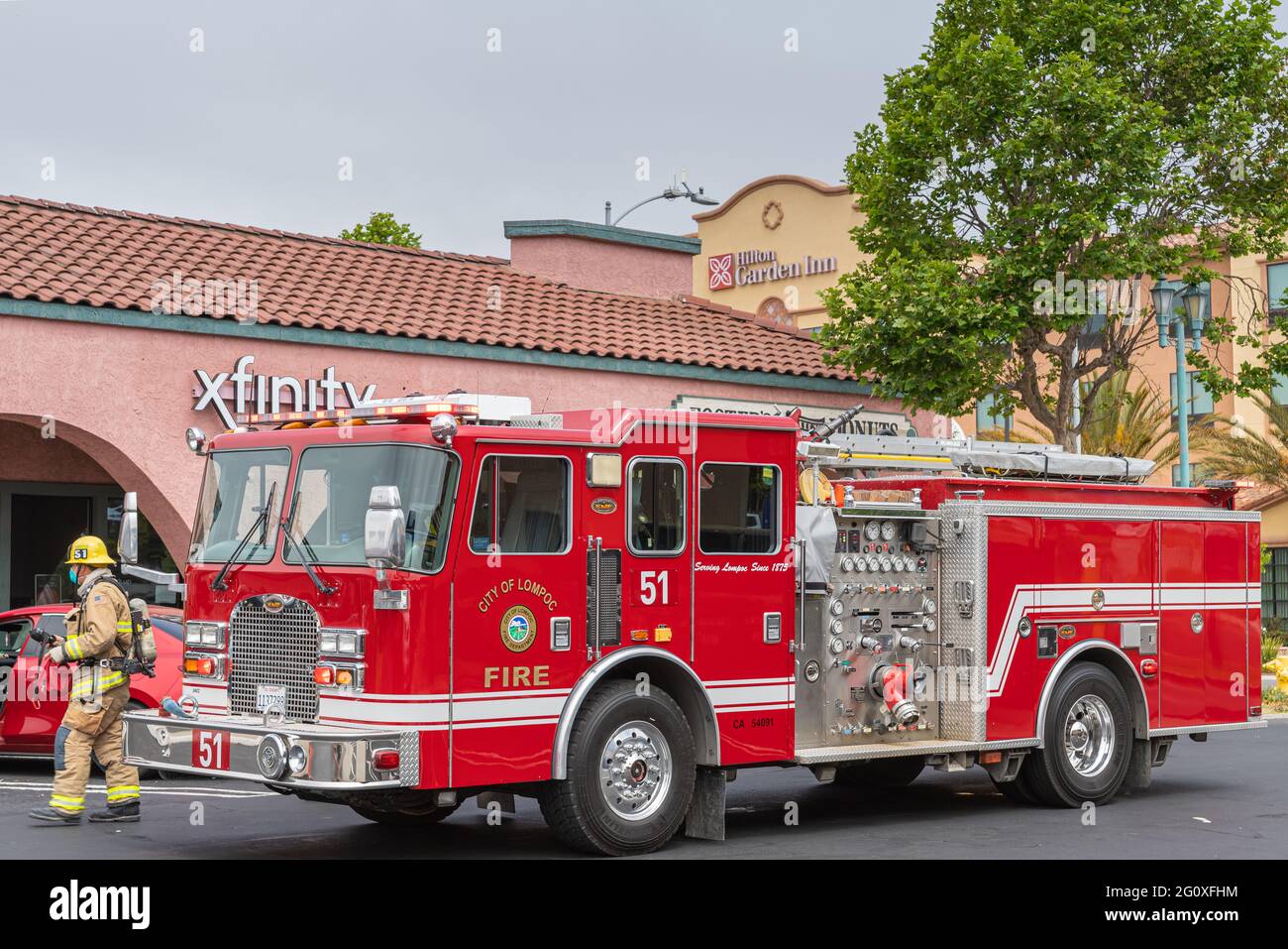 Lompoc, CA, USA - May 26, 2021: Closeup of red fire engine in town with ...