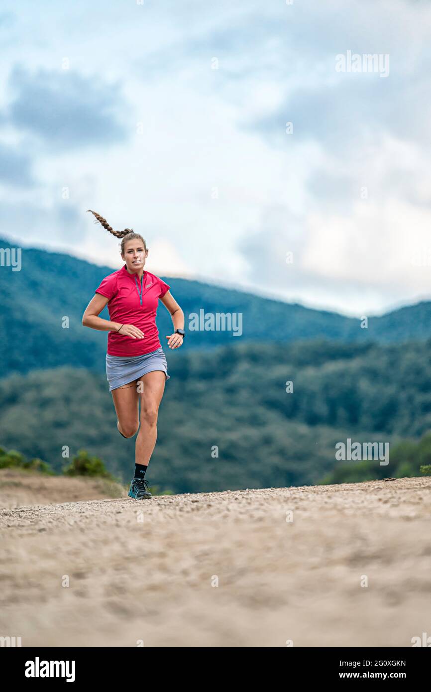 Girl running on trail, traveling through beautiful and beautiful ...