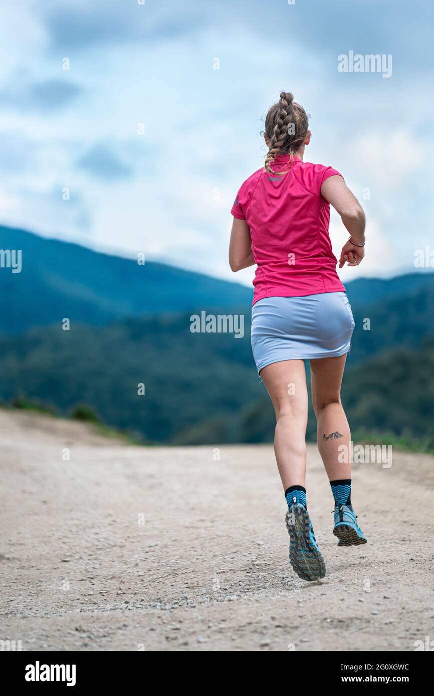Girl running on trail, traveling through beautiful and beautiful ...
