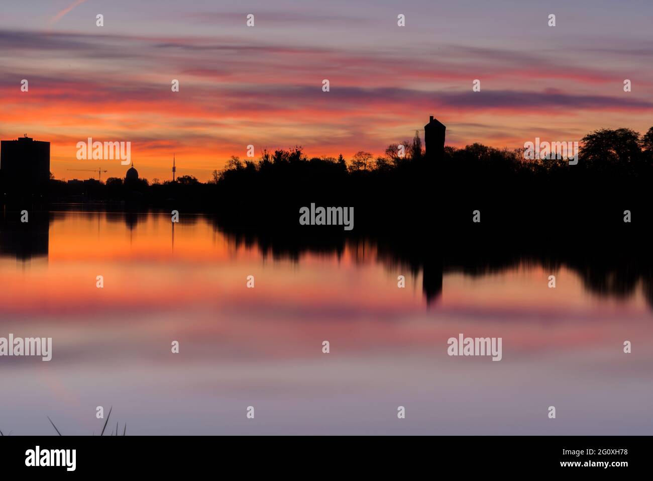 Mesmerizing view of the reflection of the buildings on the water during ...