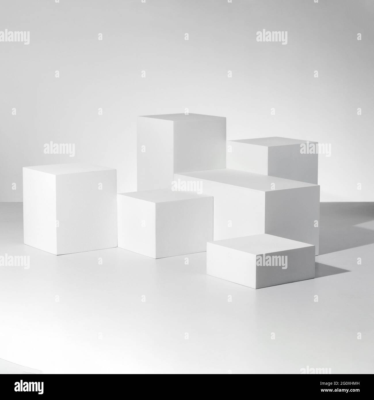 3D rendering of white empty cubes with mockup against a white ...