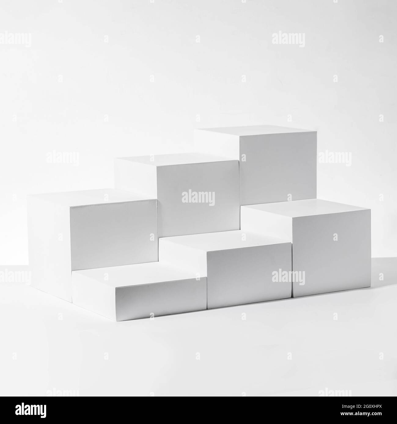 3D rendering of white empty cubes with mockup against a white ...