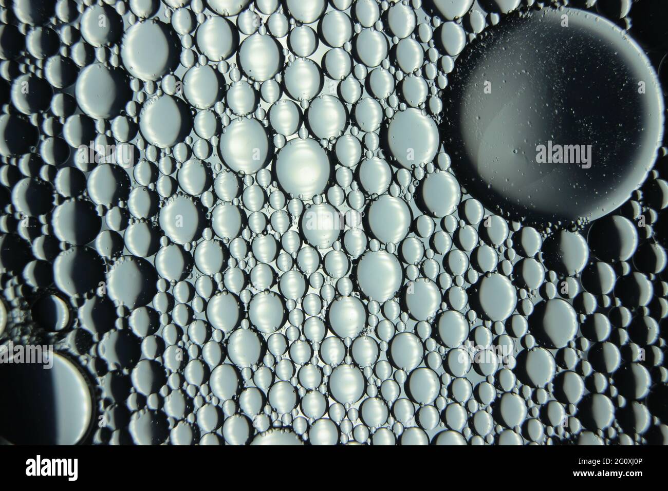 Abstract closeup view of oil bubbles on water Stock Photo - Alamy