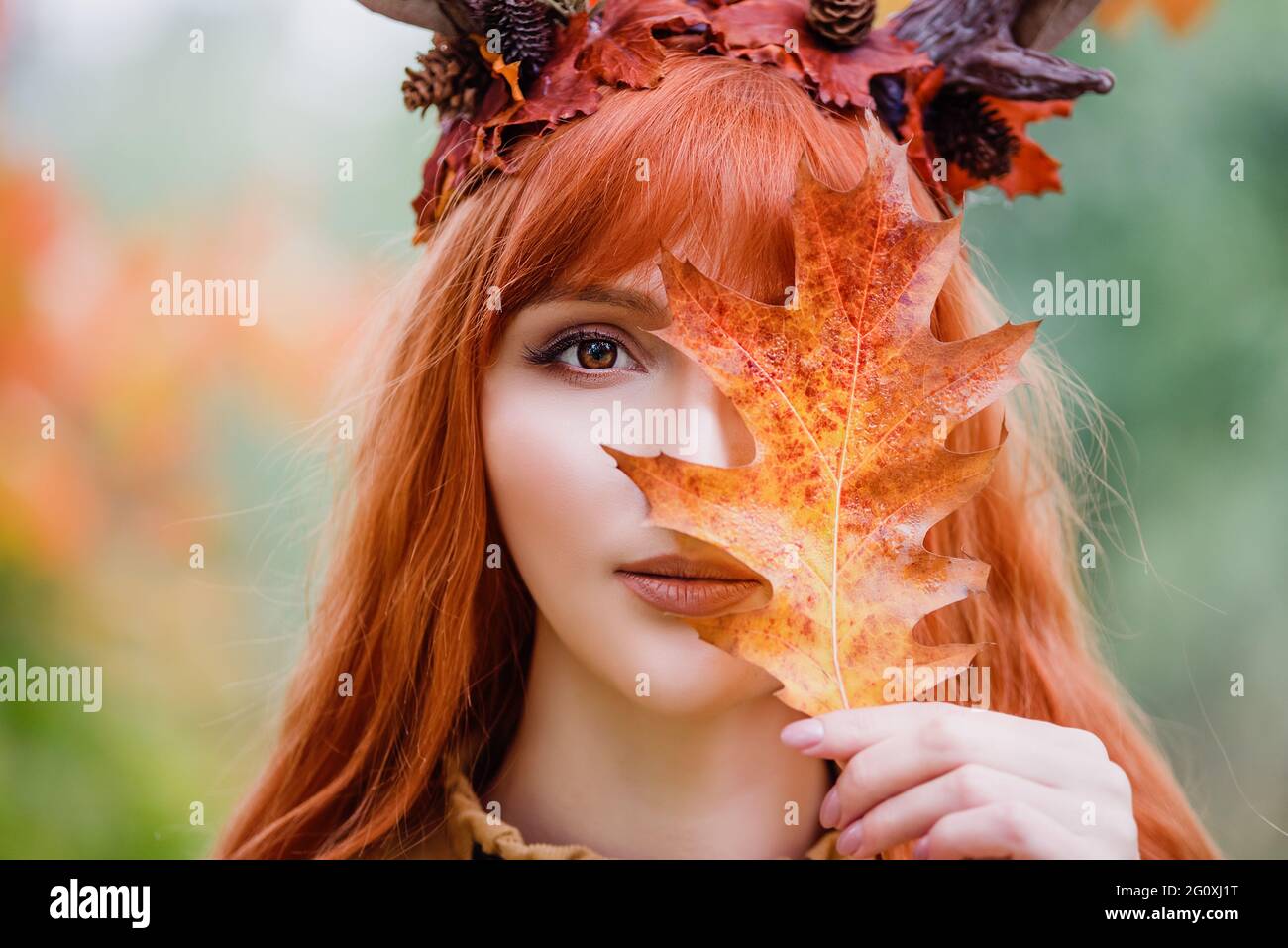 fairy woman with deer horns in autumn forest. Face painting. Beautiful ...