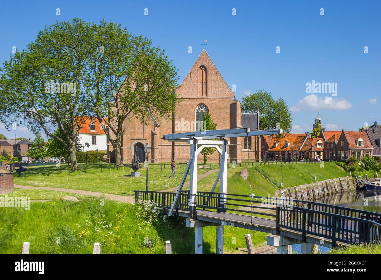 Small white bridge and historic church in the old harbor of Vollenhove ...