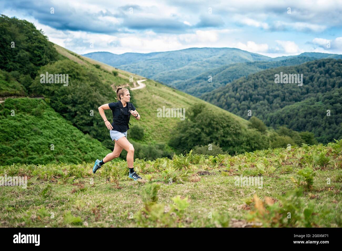 Man running along mountain trail hi-res stock photography and images ...