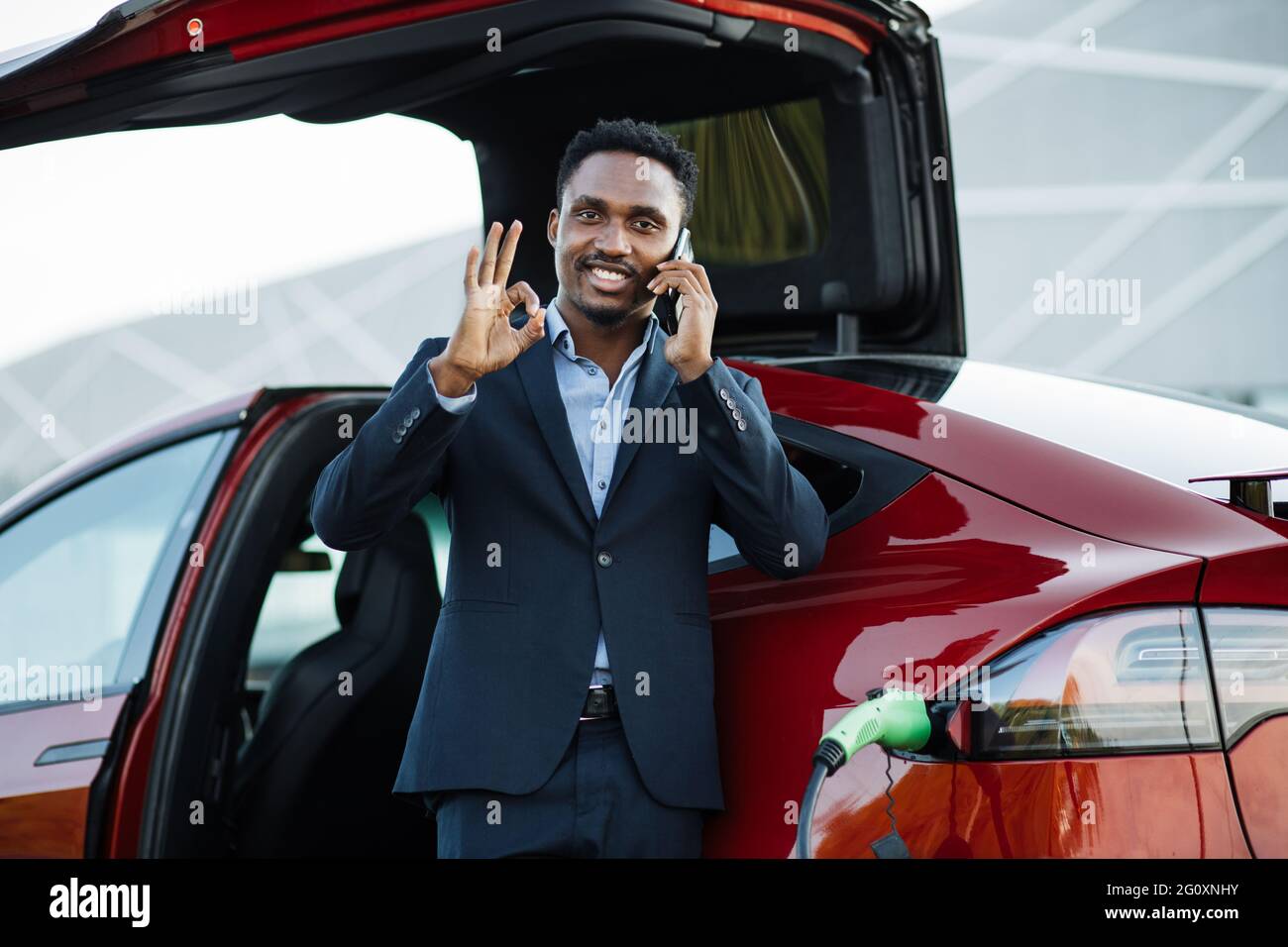 Young successful businessman charging hi-res stock photography and ...