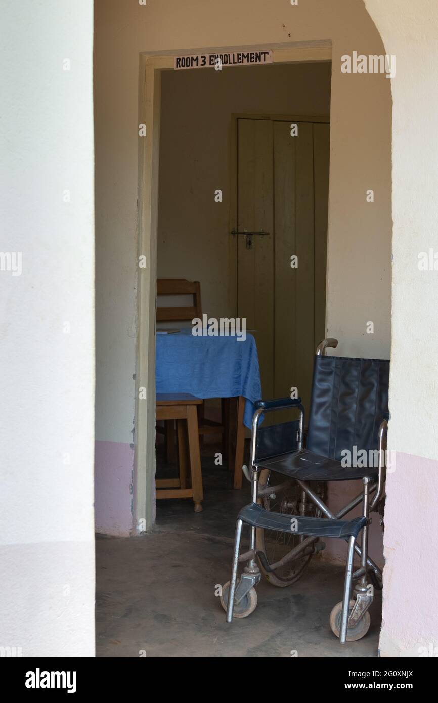 An old, rusty wheelchair in the hallway and a look into a registration ...
