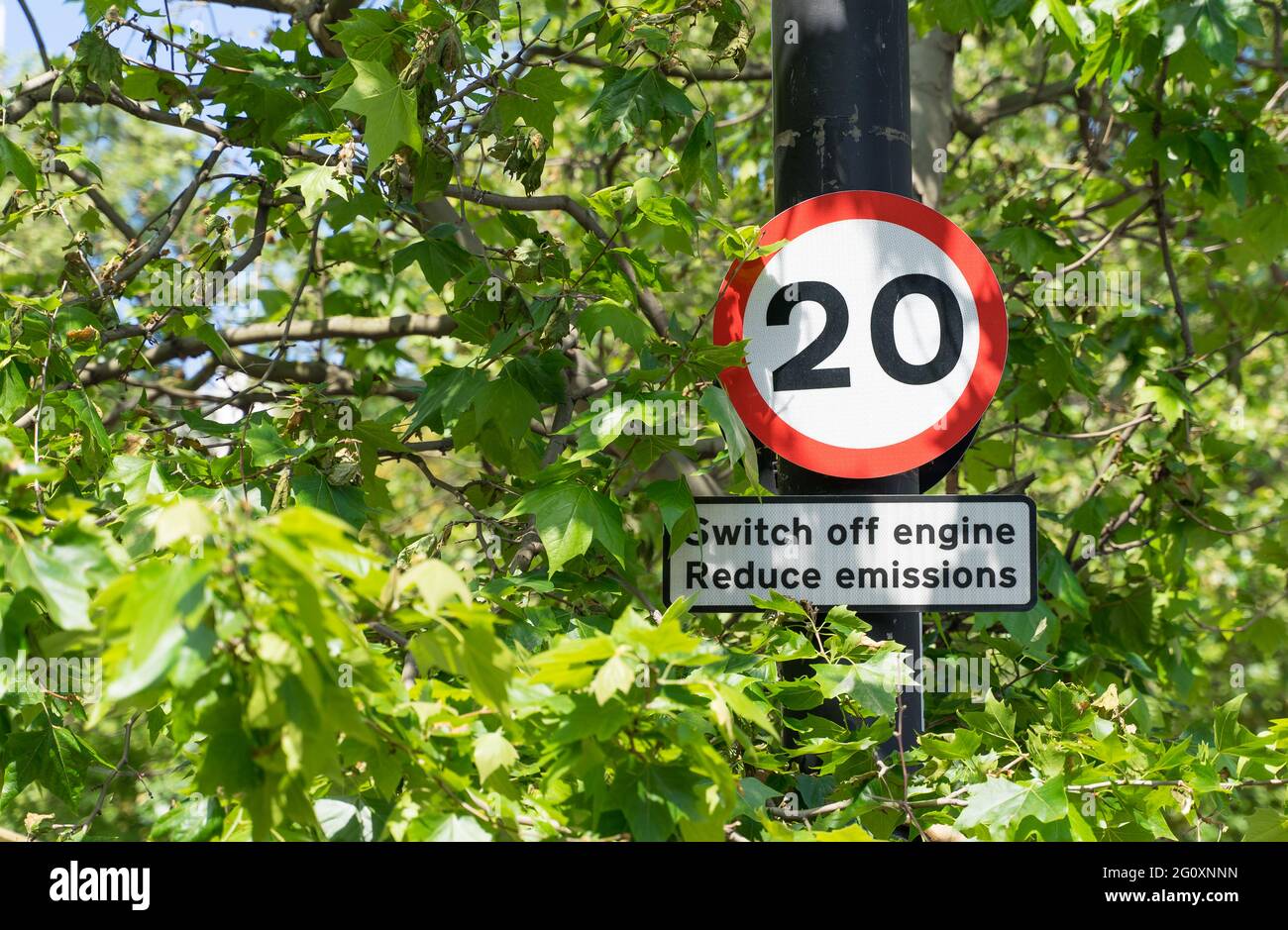 20mph and switch of engines to reduce emissions sign surrounded by ...