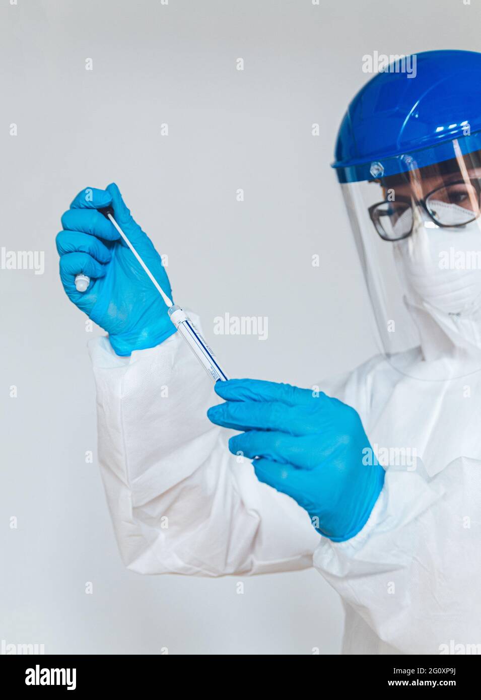 Female doctor or nurse in protective suit takes a specimen swab Stock ...