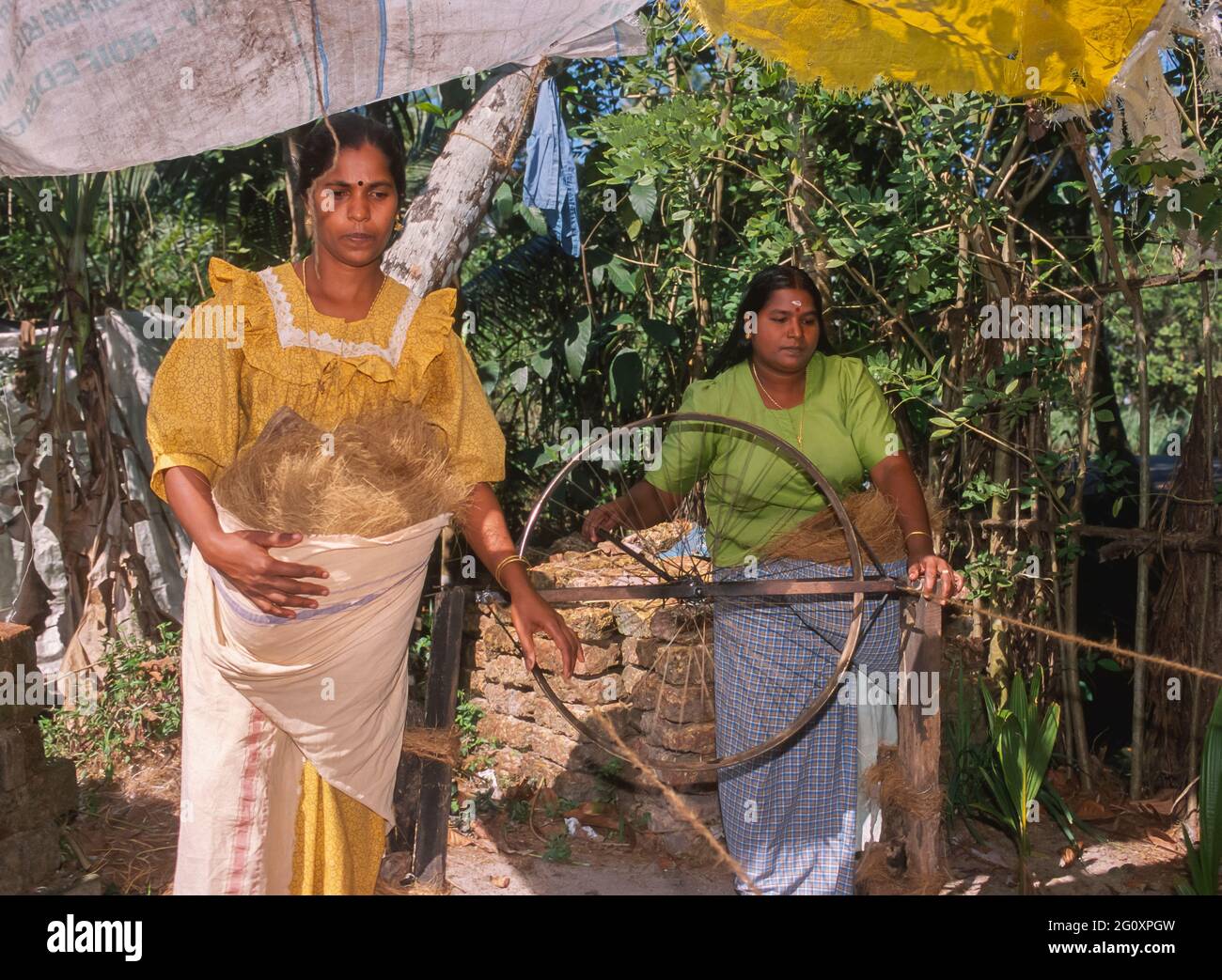 ALLEPPEY, KERALA, INDIA - Women spinning coir, coconut fiber, into ...