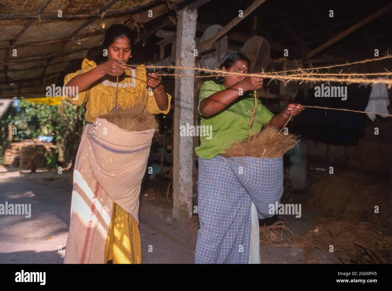 ALLEPPEY, KERALA, INDIA - Women spinning coir, coconut fiber, into ...