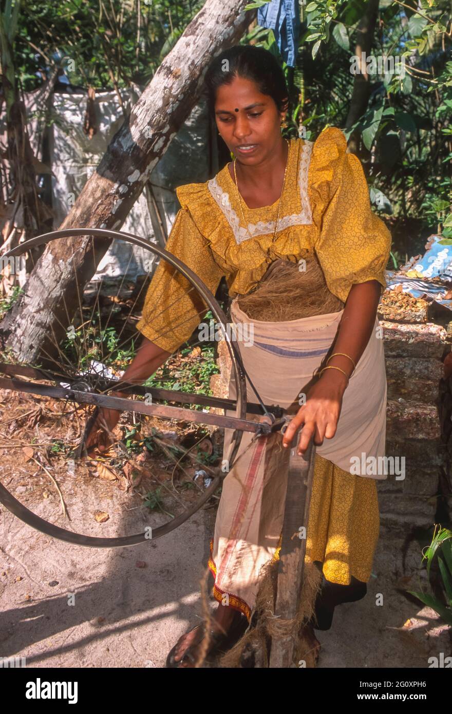 ALLEPPEY, KERALA, INDIA - Woman spinning coir, coconut fiber, into ...