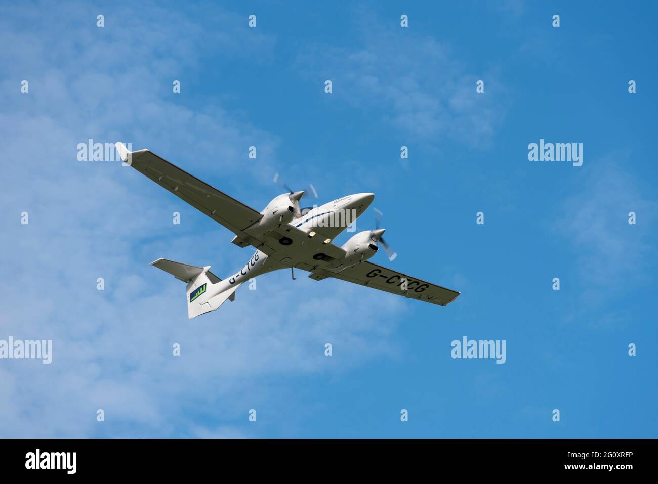 Diamond DA 42 Twin Star light aircraft plane G-CTCG climbing after ...