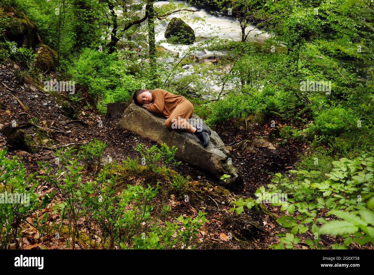 Girl resting in forest hi-res stock photography and images - Alamy