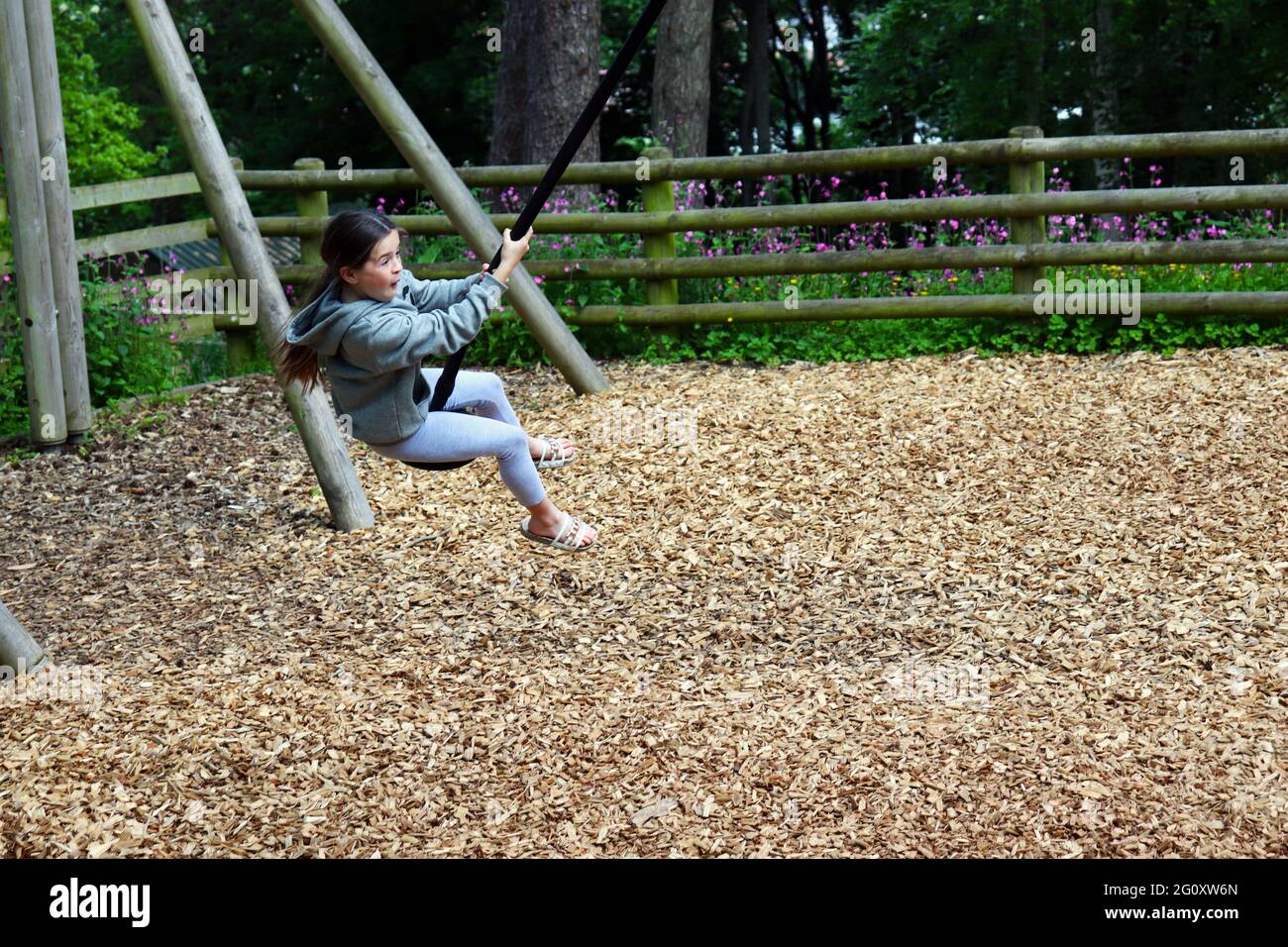 child playing on zip swing Stock Photo - Alamy