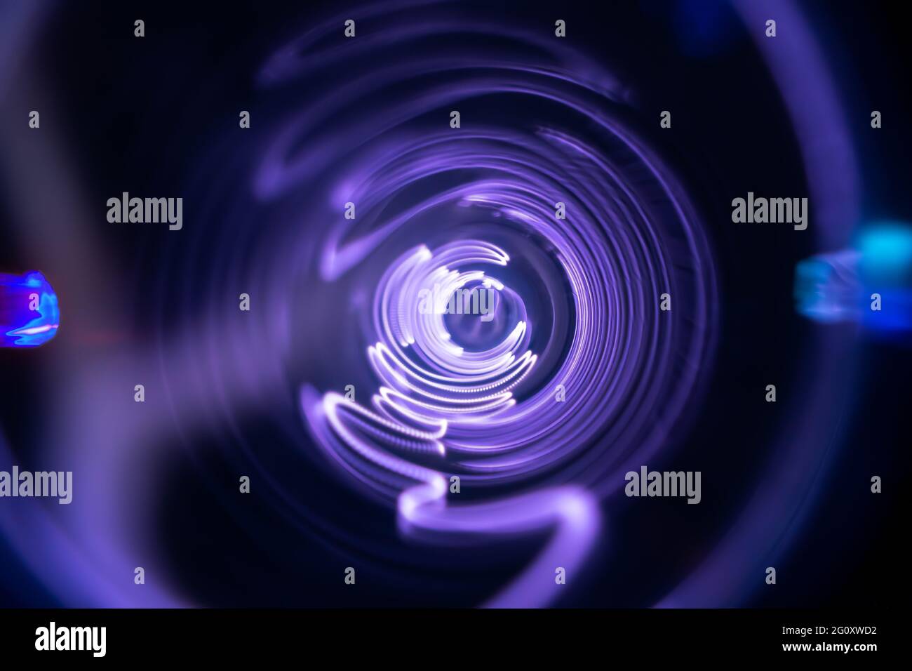 Plasma tunnel and violet electric flashes as abstract futuristic neon ...