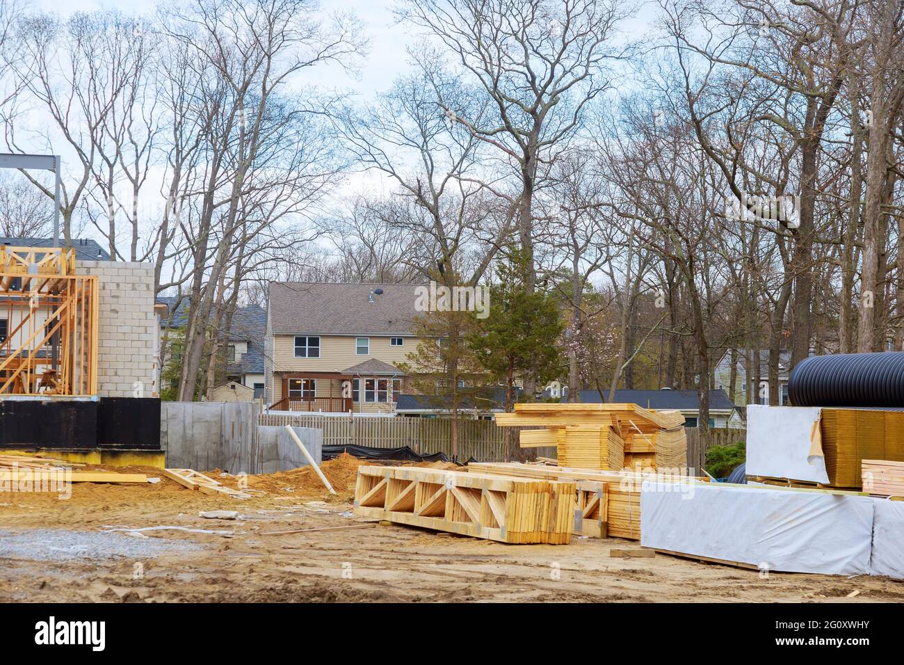 View of on stacker wooden material boards and beams for new house on of ...