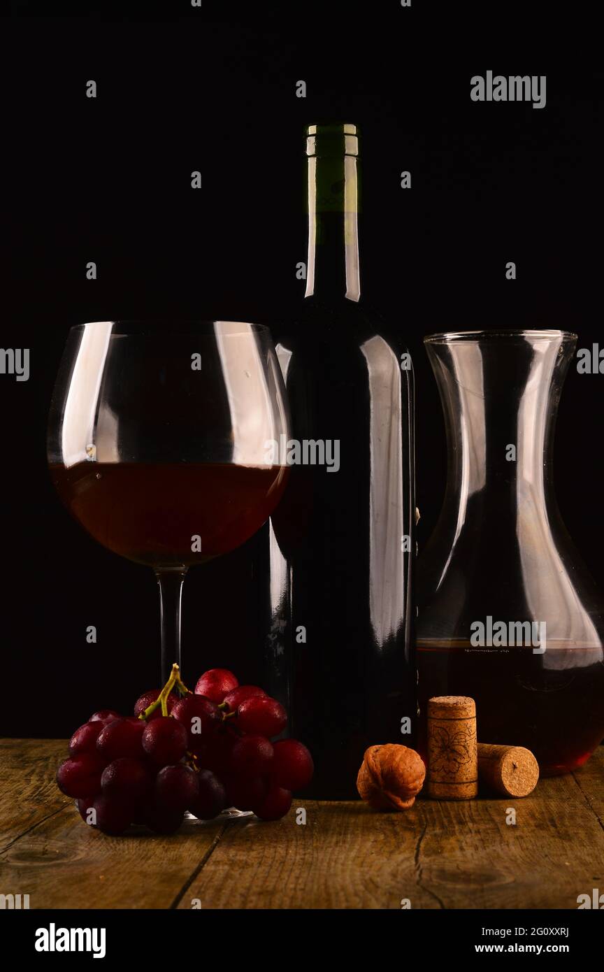 Glass and bottle of wine on the table Stock Photo - Alamy