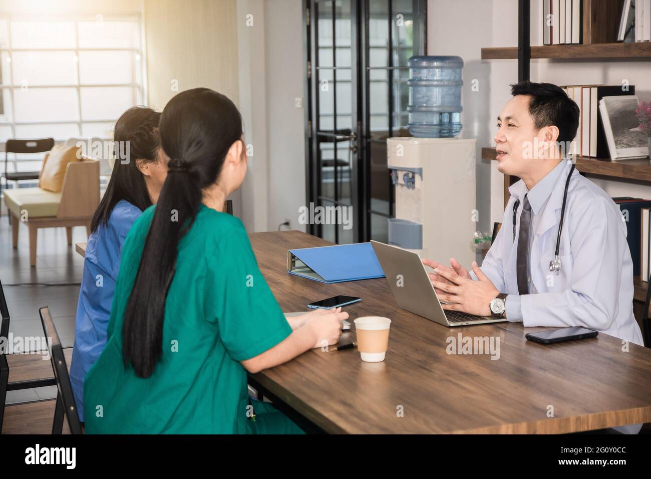 Team doctors meeting to plan the treatment of the patient. Doctors ...