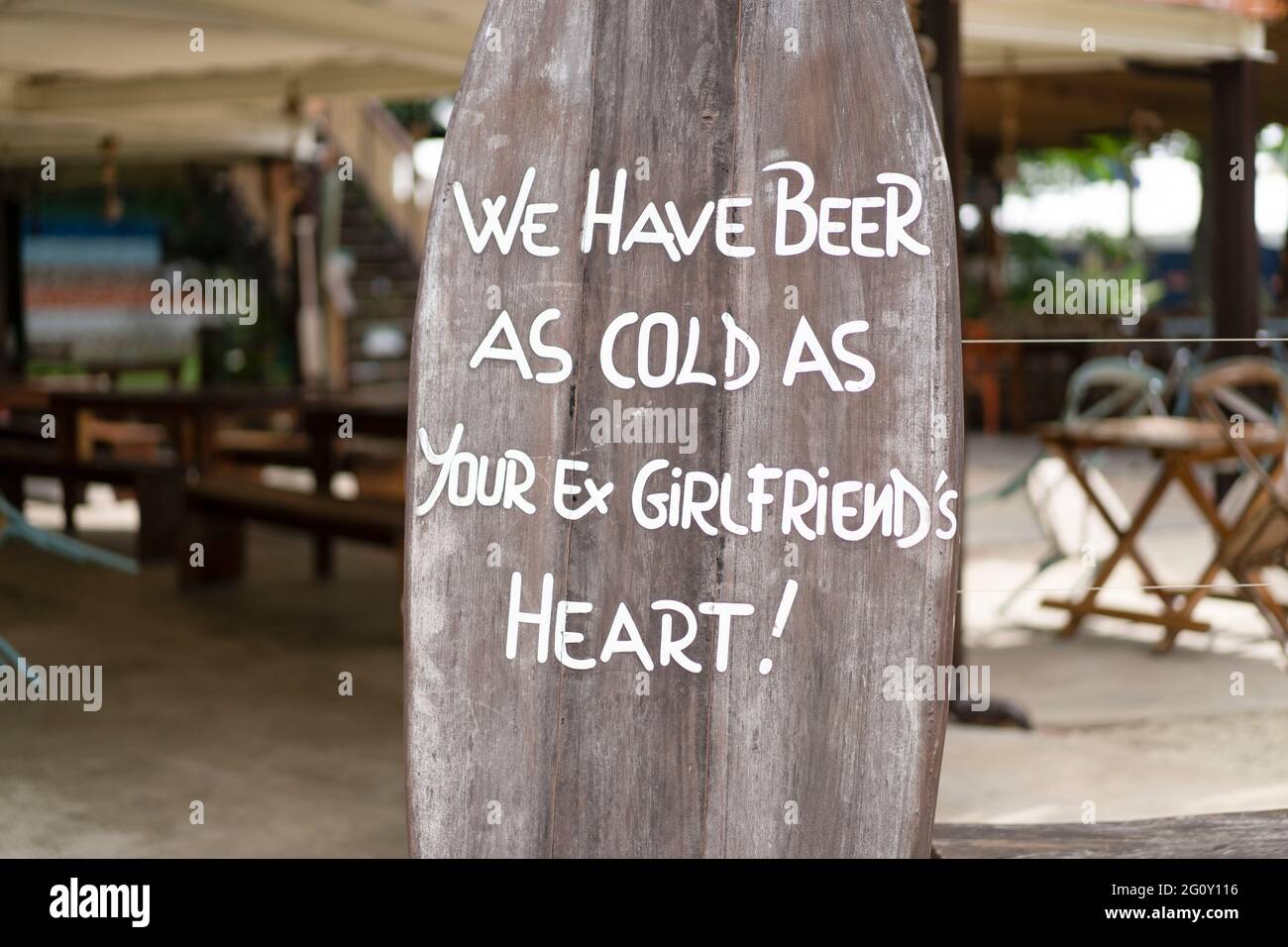 Signage about beer written on an old surfboard Stock Photo - Alamy