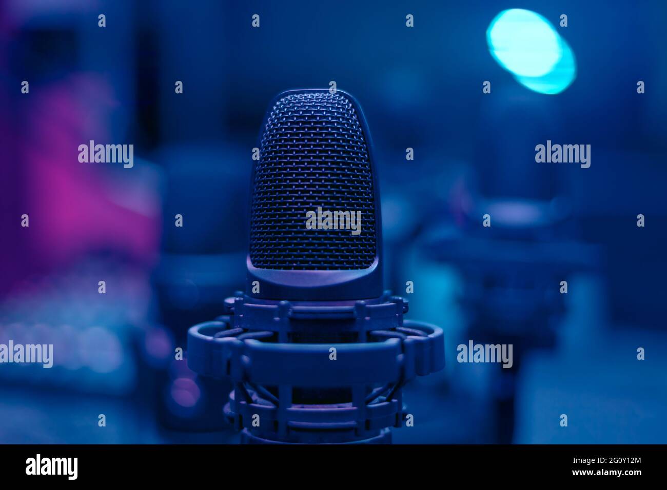 Microphone in blue room . Low light in broadcasting studio Stock Photo ...