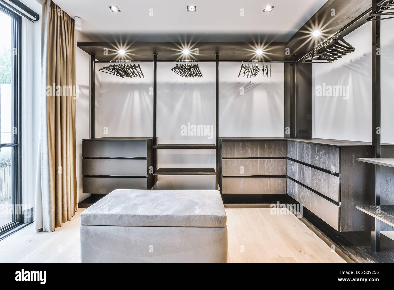 Interior of a big and stylish wardrobe Stock Photo - Alamy