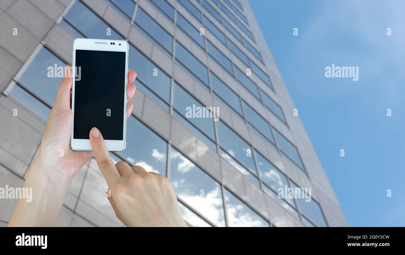 Hand holding blank screen smart phone with buiding background Stock ...