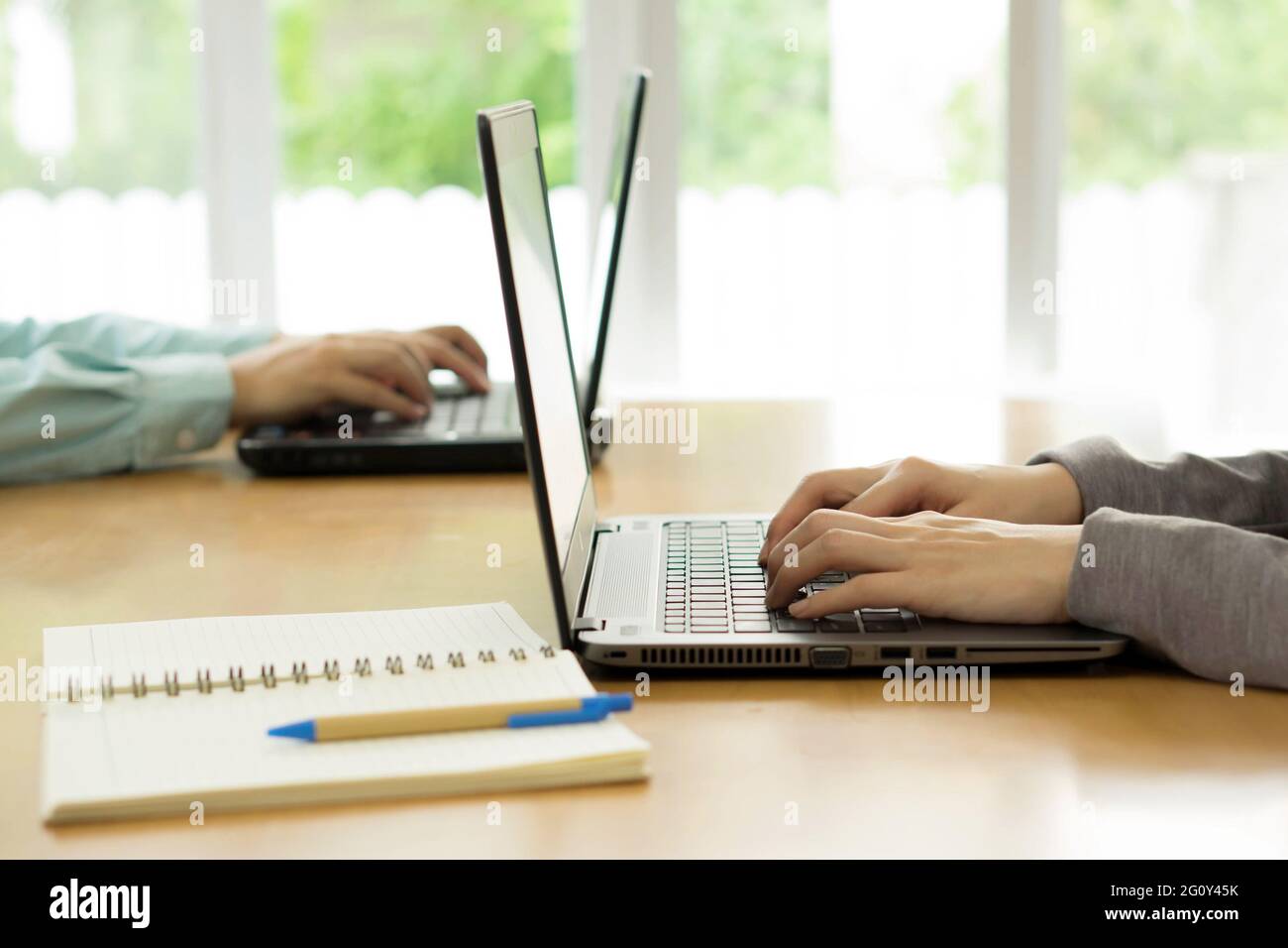 Business people working with laptop computer in office Stock Photo - Alamy