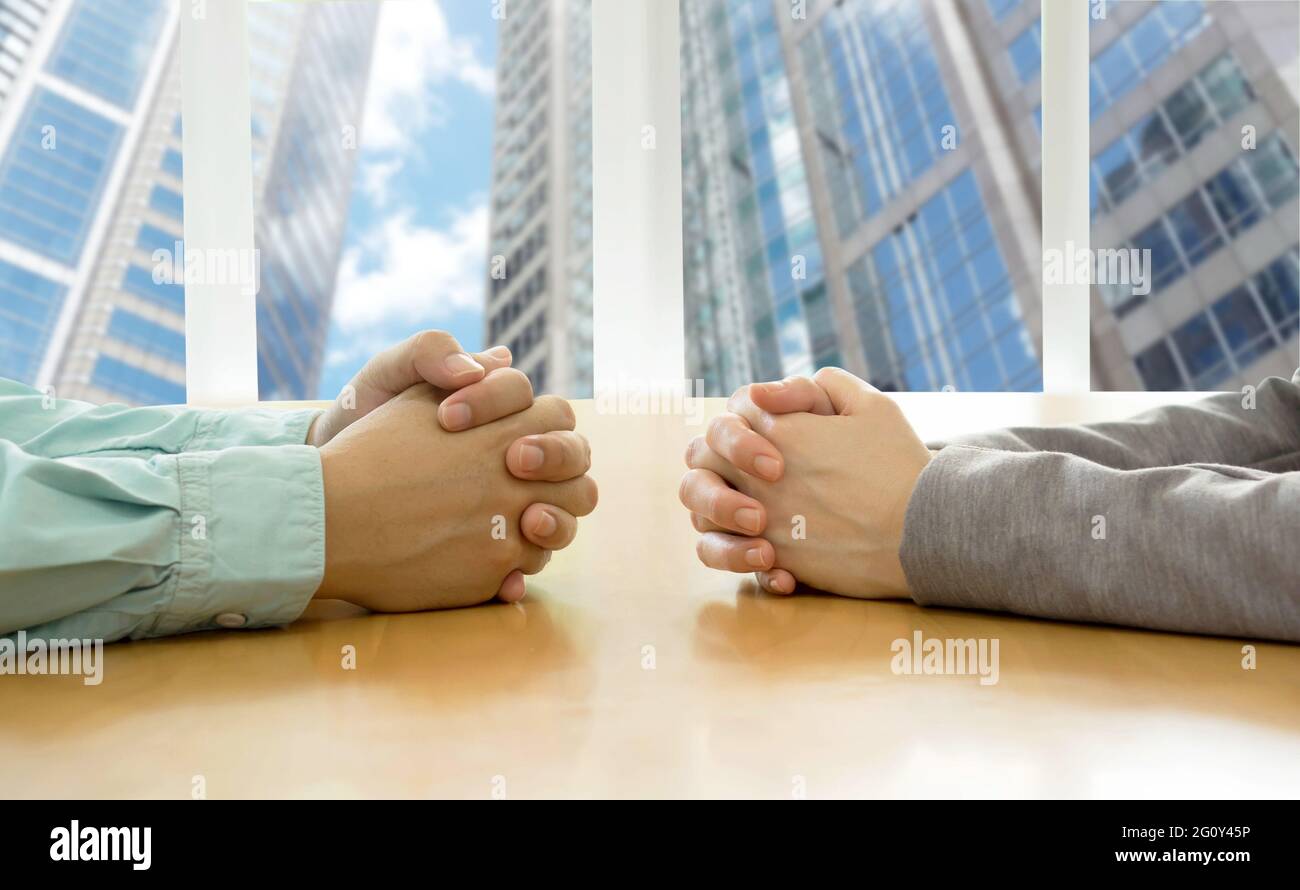 Negotiation of two businessman with clasped hands in office Stock Photo ...