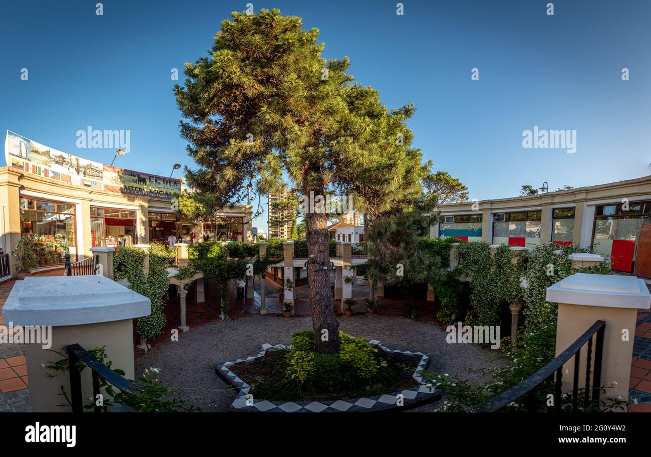 Panoramic view of elegant outdoor Spanish architecture shopping mall ...