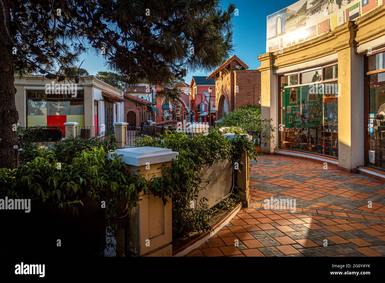 Open view of elegant outdoor Spanish architecture shopping mall on ...