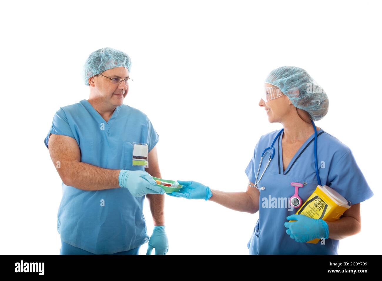 Two happy healthcare workers, nurses at work together in hospital or ...