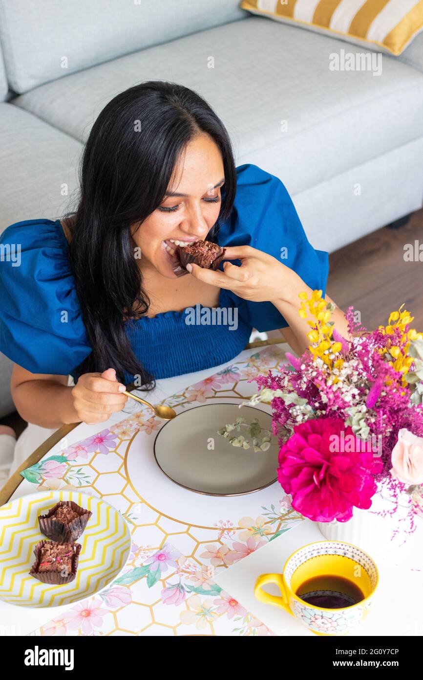 Woman eating sweets hi-res stock photography and images - Alamy