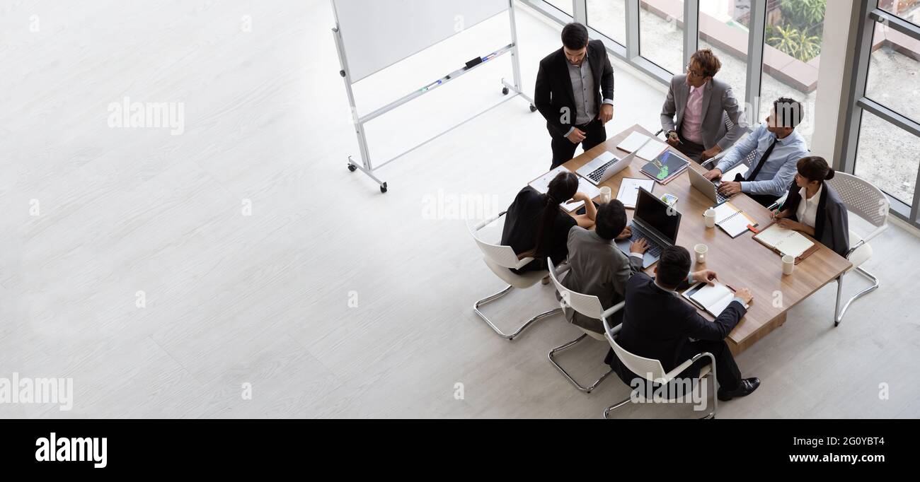 Top view of group of multiethnic busy people working in an office ...