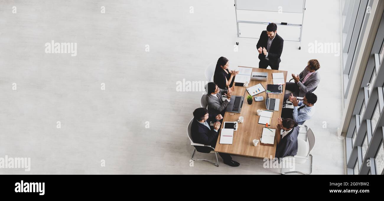 Top view of group of multiethnic people meeting in an office, Aerial ...