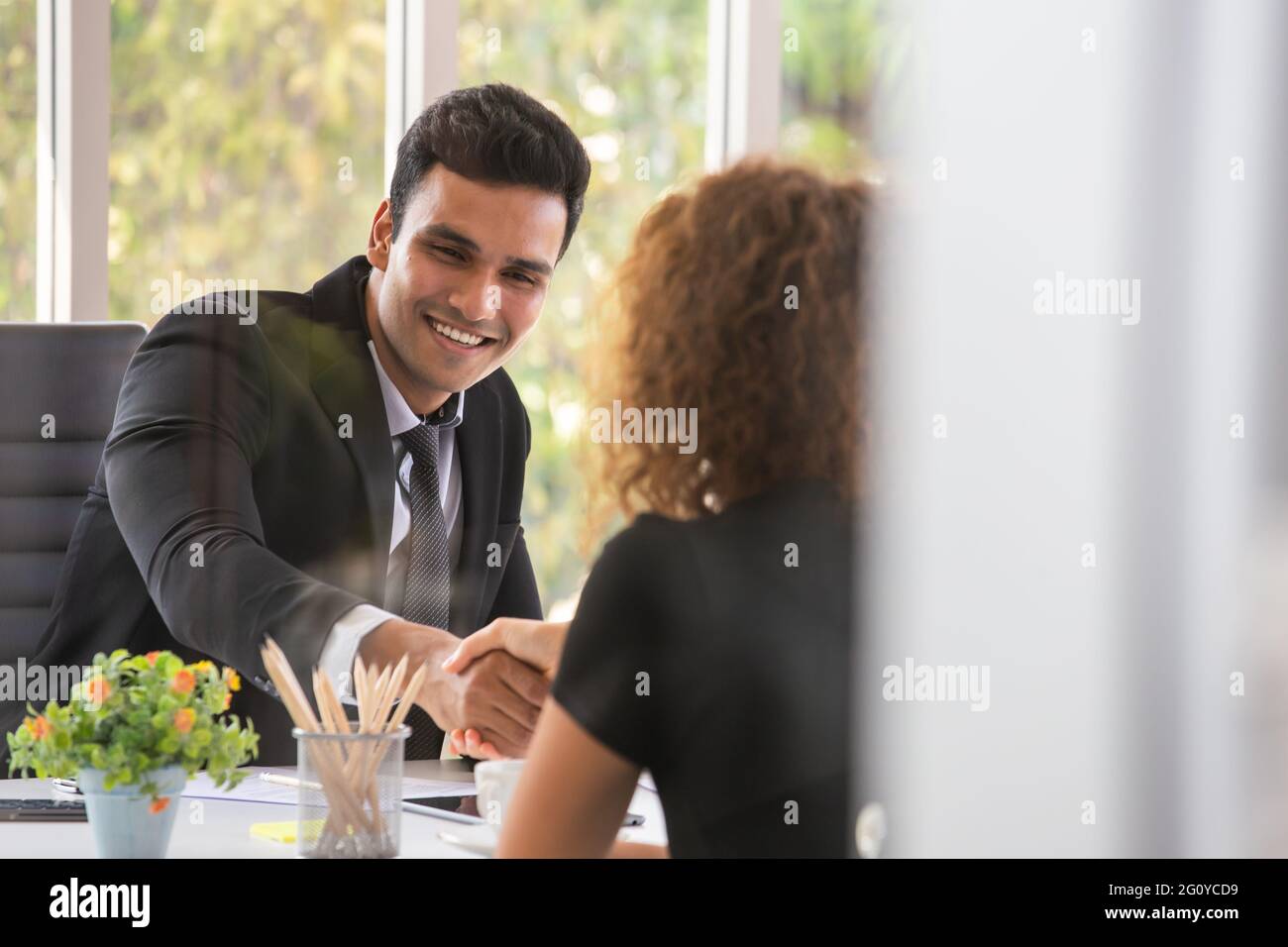 Recruitment officers shaking hand with candidate arrived for job ...