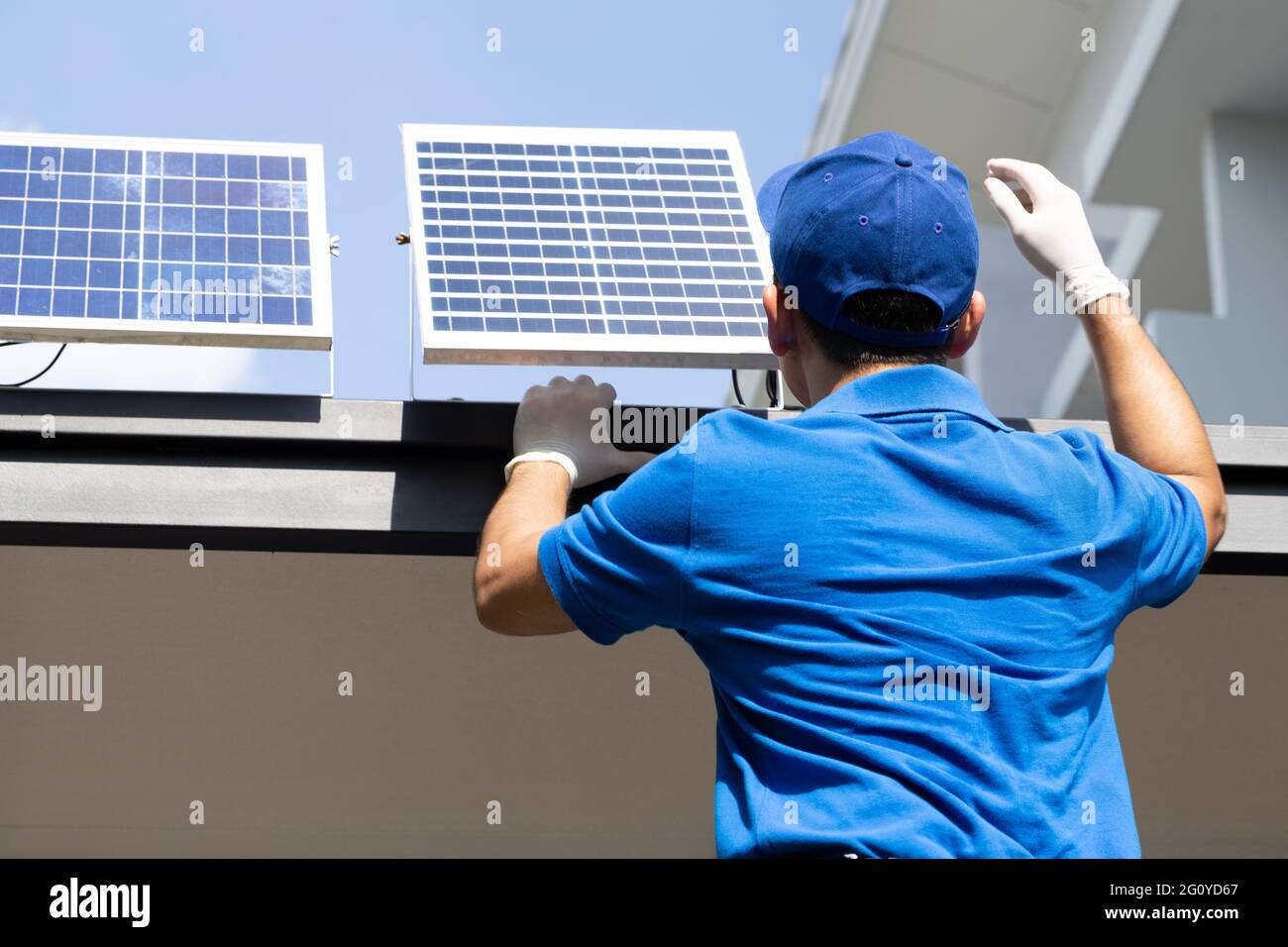 Asian workers technicians man installing solar photovoltaic panels for ...