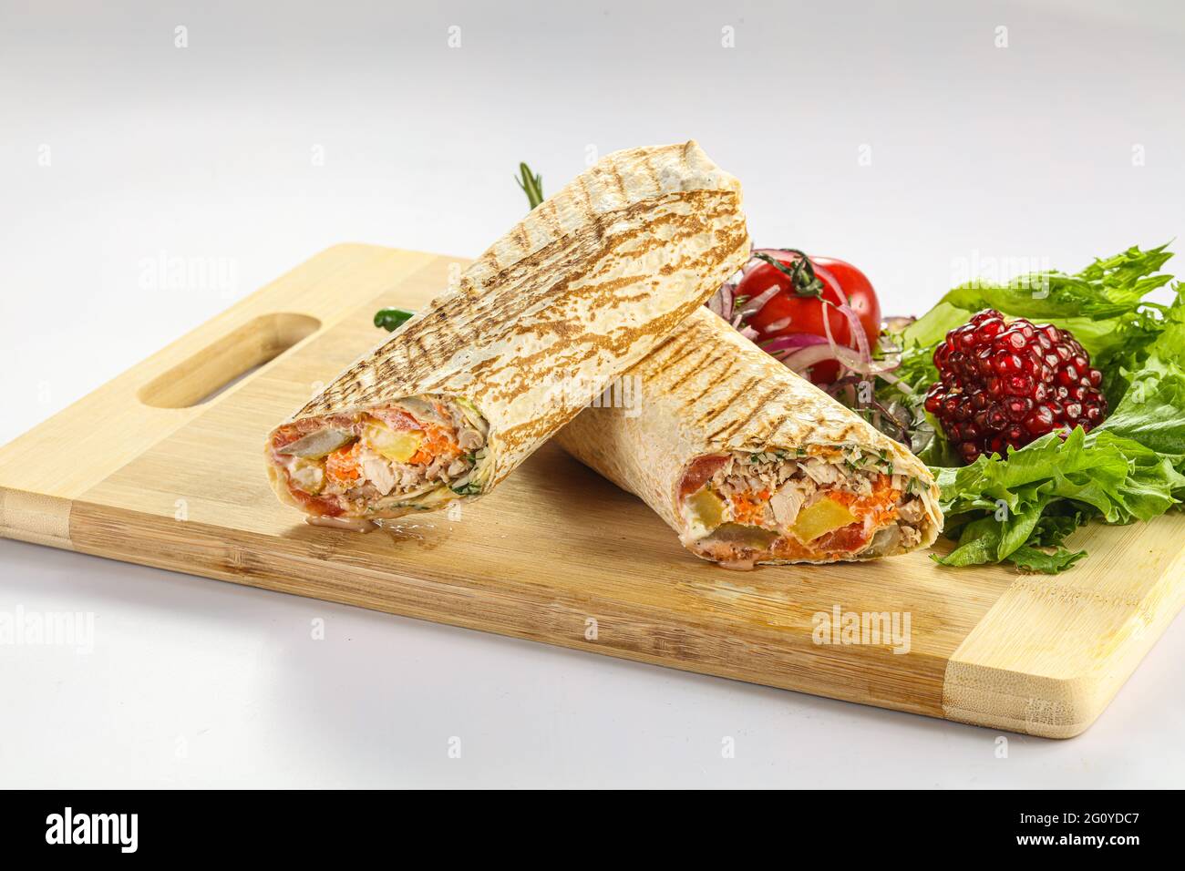 Tasty shawarma with meat, sauce and vegetables Stock Photo - Alamy