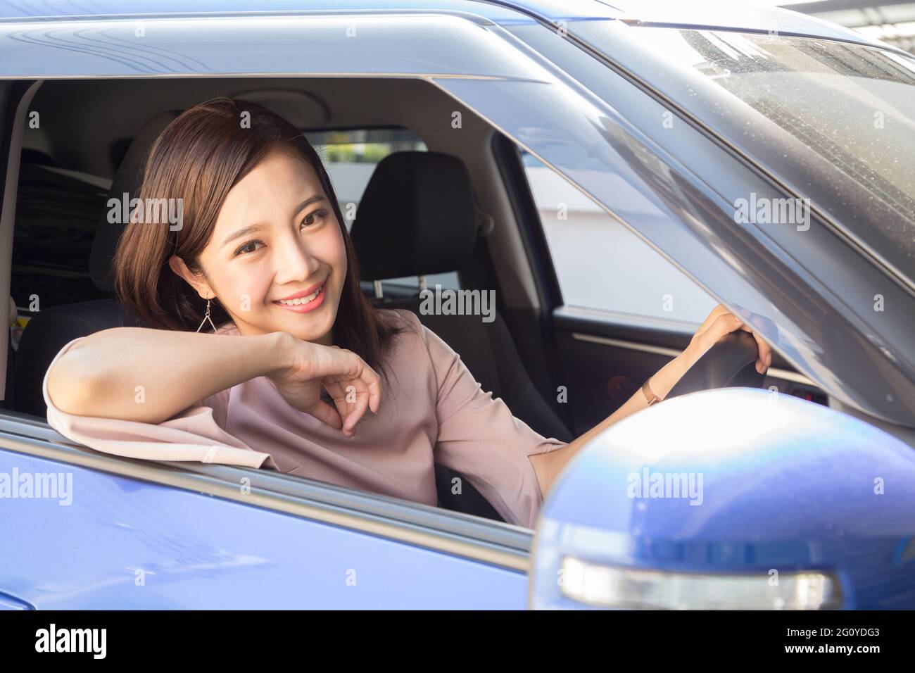 Asian women driving a car and smile happily with glad positive ...