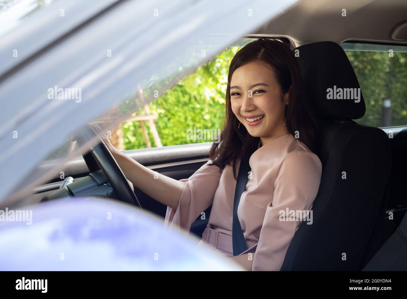 Attractive Asian Girl Sitting In A Car High Resolution Stock ...