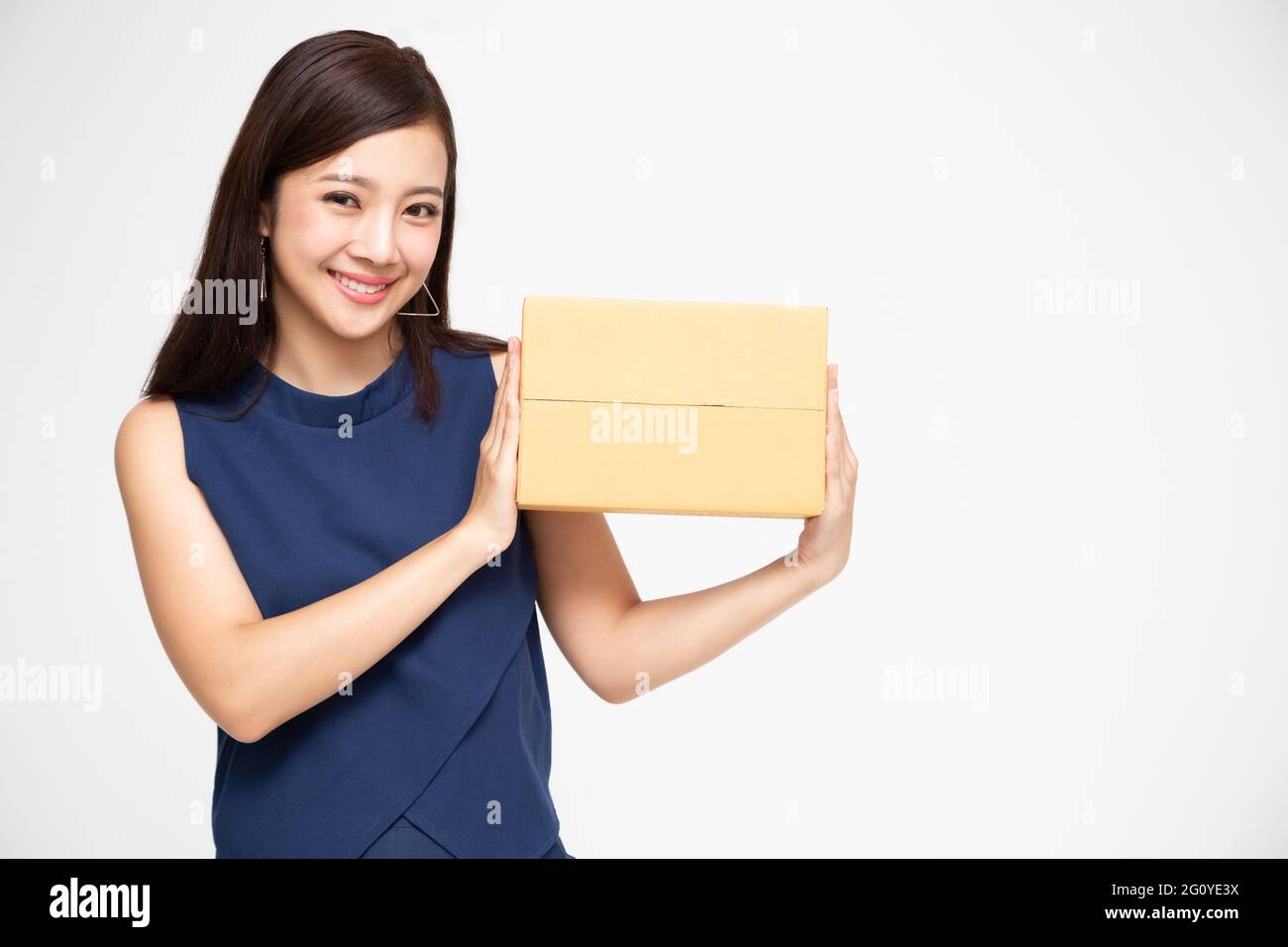 Happy Asian woman holding package parcel box, Delivery courier and ...