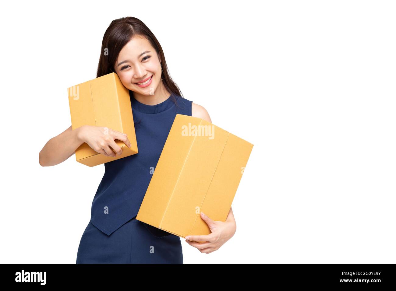 Happy Asian woman holding package parcel box on white background ...