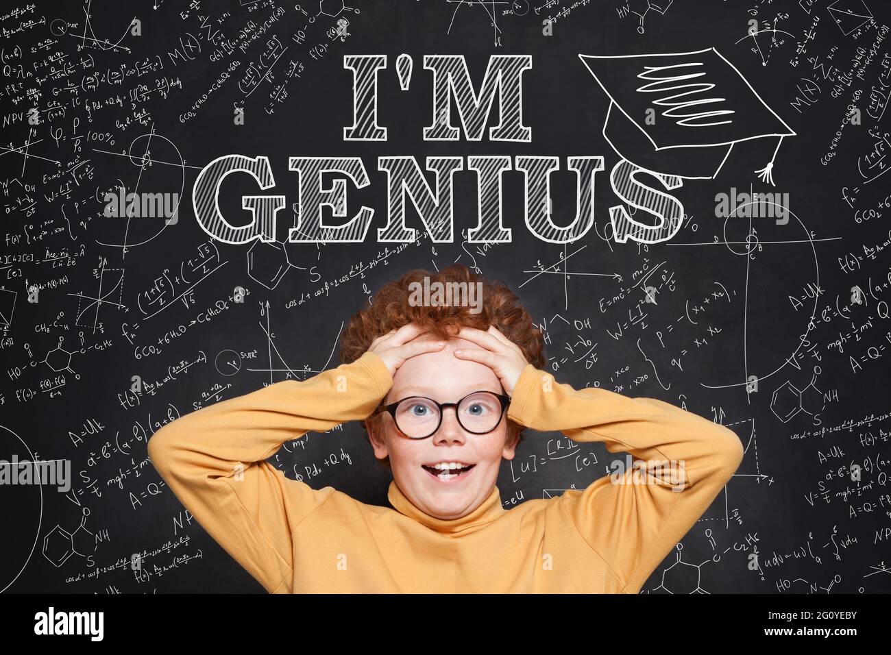 Portrait of little boy genius having fun. Happy surprised redhead kid ...