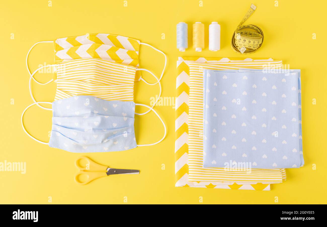 Eco-friendly reusable cloth face shield and sewing accessories on top ...