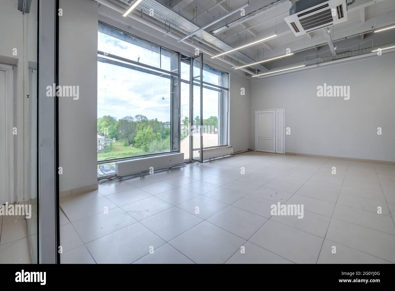 Modern white empty room interior with columns and panoramic windows ...