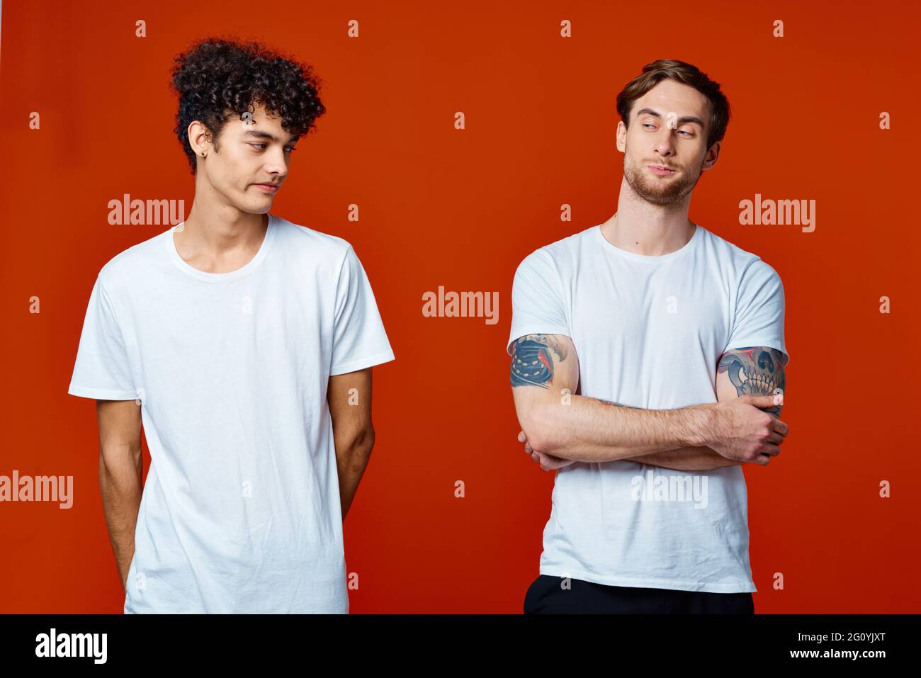 Two friends t-shirts communicating isolated background fun Stock Photo ...