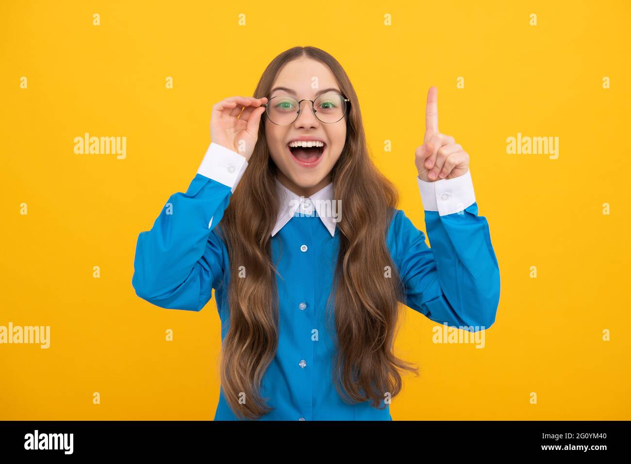 Genius idea. Girl genius with raised finger. Child prodigy in ...