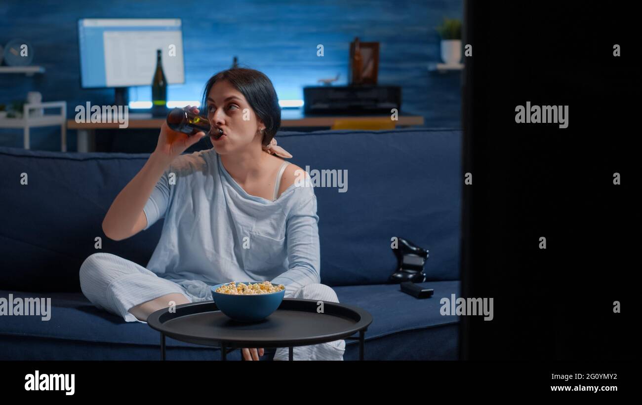 Upset pro gamer losing soccer video games holding wireless controller ...